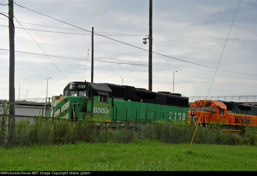 BNSF 2138 and a line of other's Waite for work.